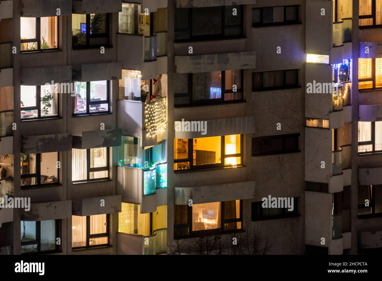 Colorful lit windows of apartments at christmas time at night hi-res ...