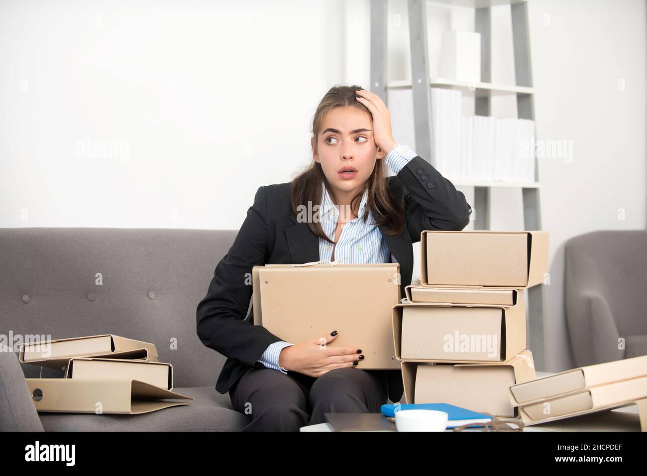 Busy business woman with many folders of documents, secretary girl ...
