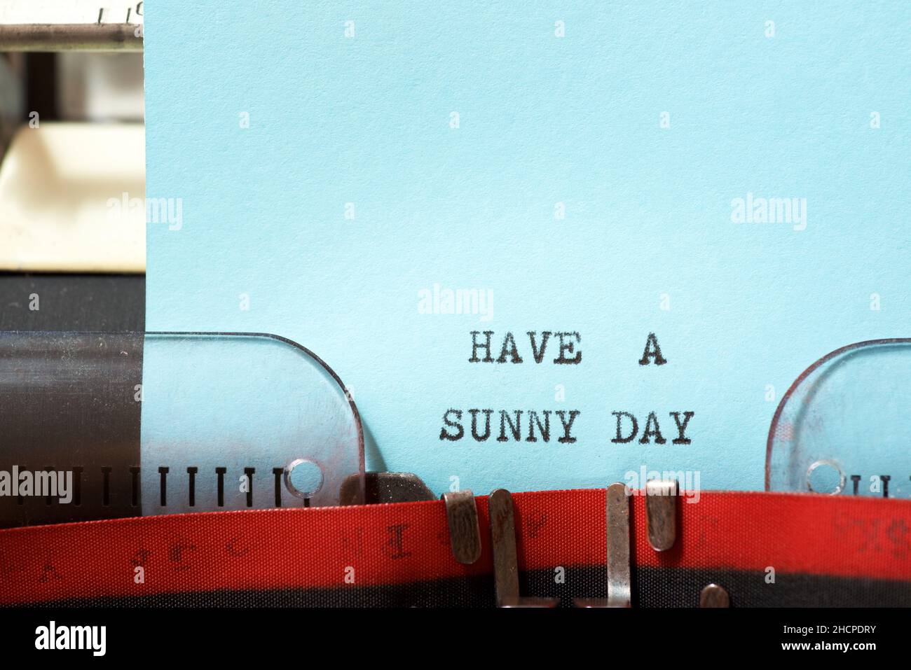 Have a sunny day text written with a typewriter Stock Photo - Alamy