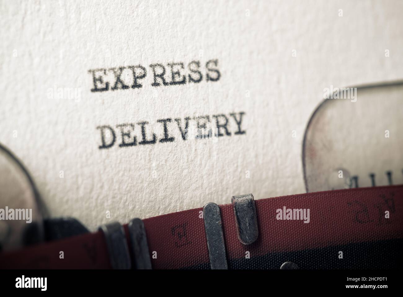 Express delivery text written with a typewriter Stock Photo - Alamy