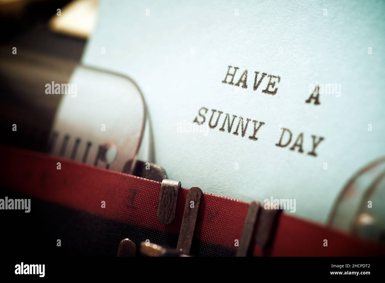 Have a sunny day text written with a typewriter Stock Photo - Alamy