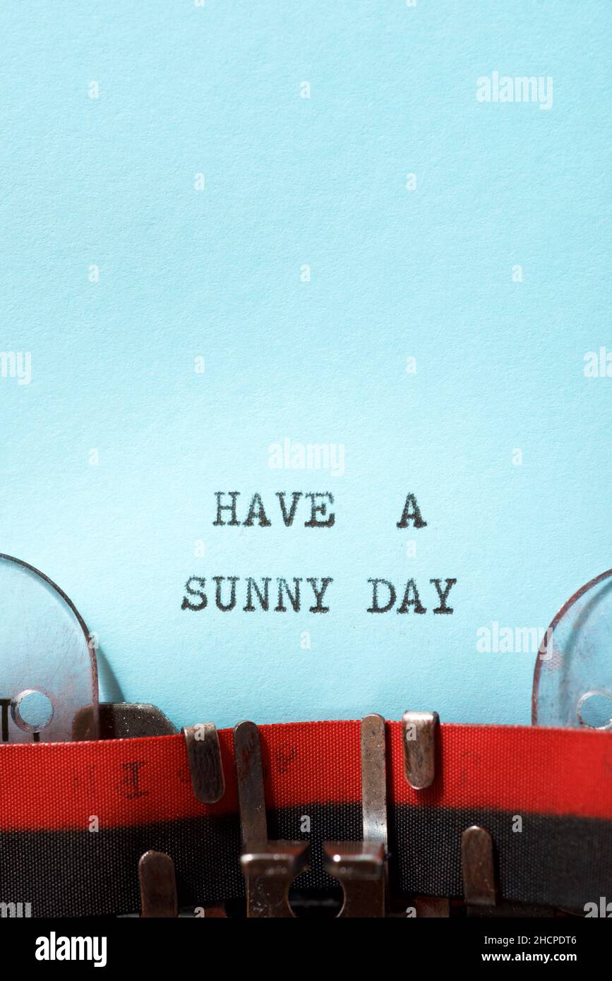 Have a sunny day text written with a typewriter Stock Photo - Alamy