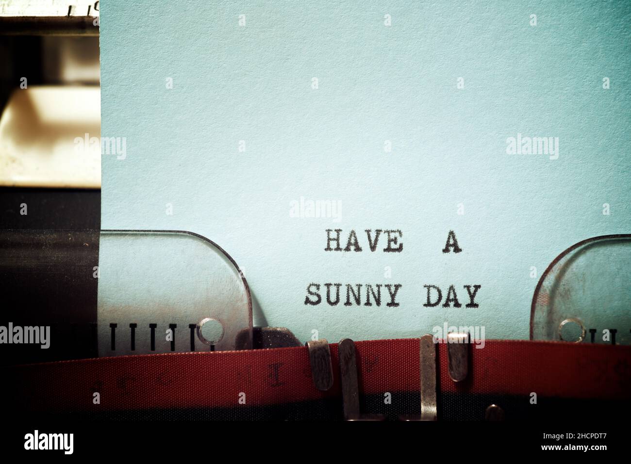 Have a sunny day text written with a typewriter Stock Photo - Alamy