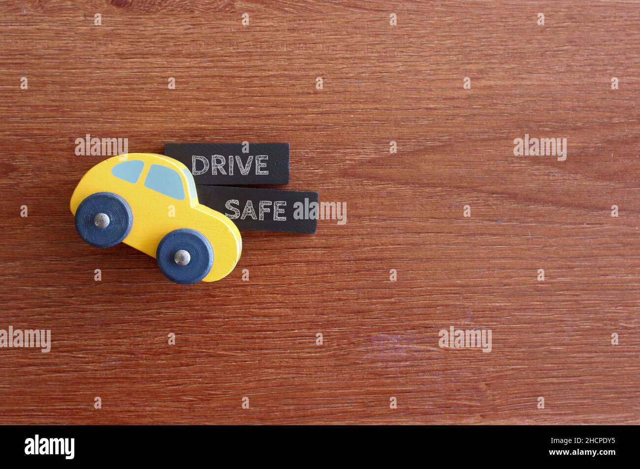Transportation and driving concept. Top view of wooden toy car with ...