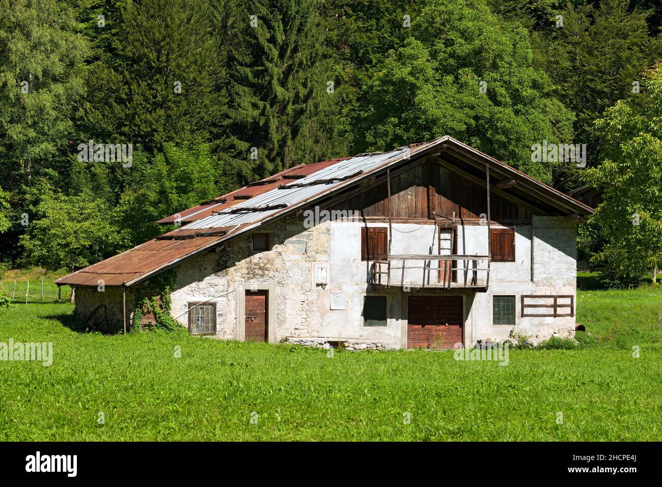Typical old farm house with barn in mountain. Alps, Trento province ...