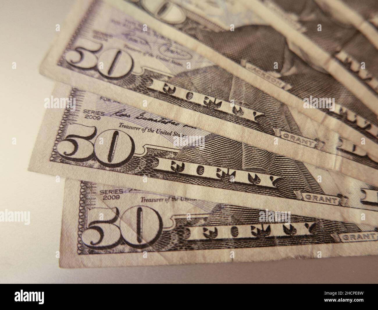 Multiple US $50 bills laying flat Stock Photo - Alamy