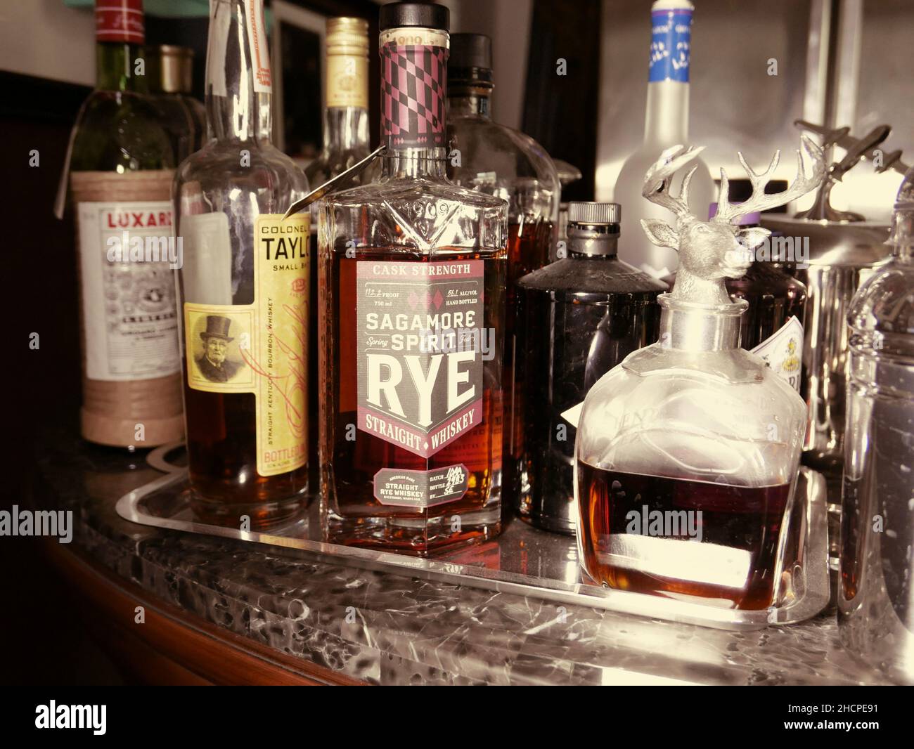 Selection of alcohol bottles on bar Stock Photo - Alamy