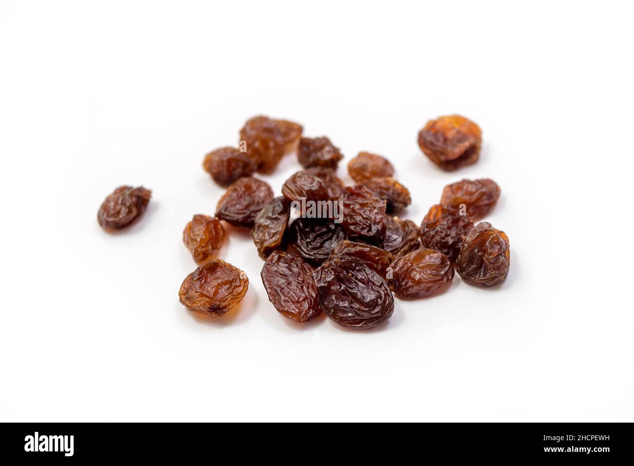Raisins on white background, dried seedless grapes. Isolated Raisin ...