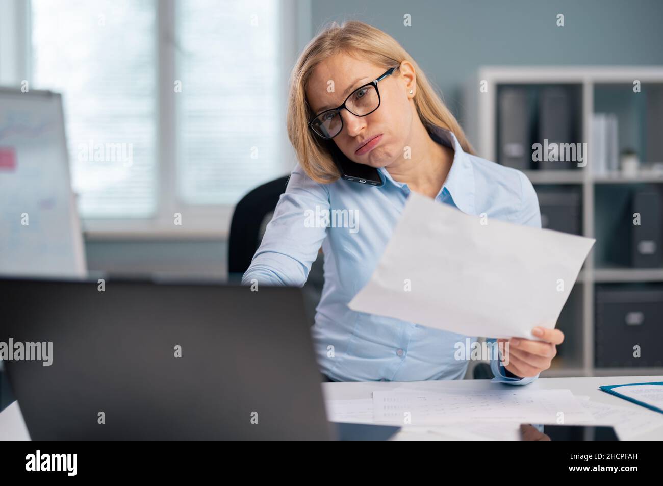 Busy woman work at office Stock Photo - Alamy
