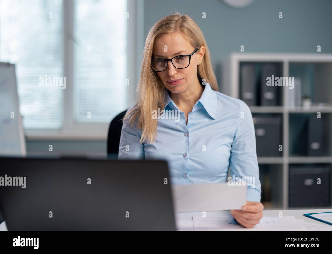 Focused business woman working documents hi-res stock photography and ...