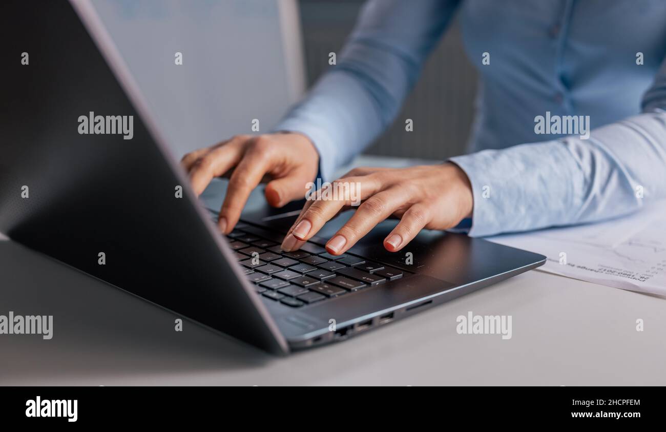 Confident mature woman typing hi-res stock photography and images - Alamy