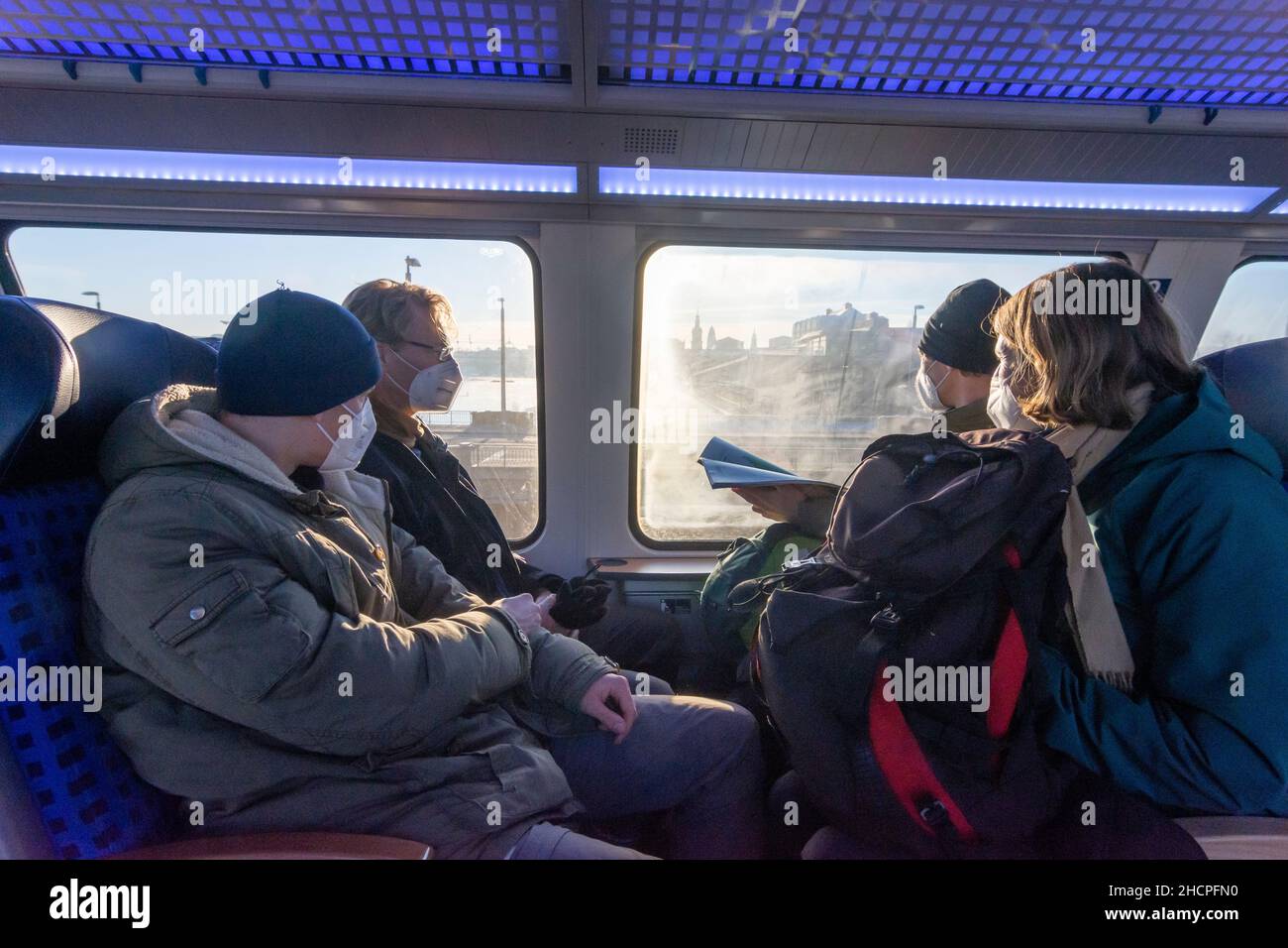 Dresden: S-Bahn train, passenger with FFP2 Filtering Face Piece mask on ...