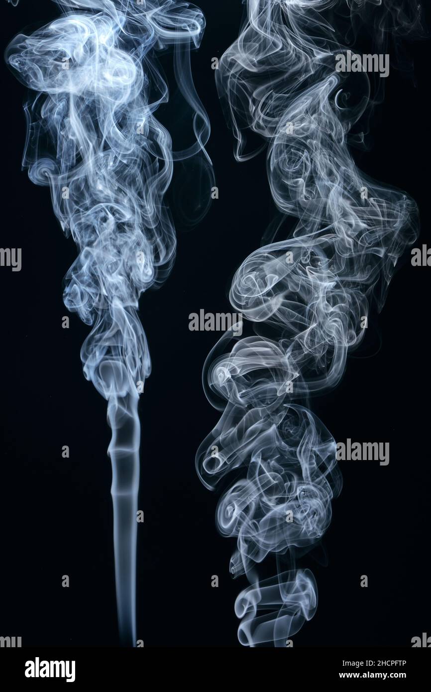 Two jets, clouds smoke curls on black background Stock Photo - Alamy