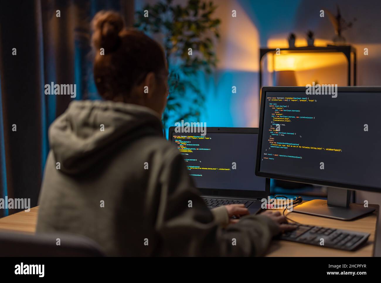 Woman using computers for programming Stock Photo - Alamy