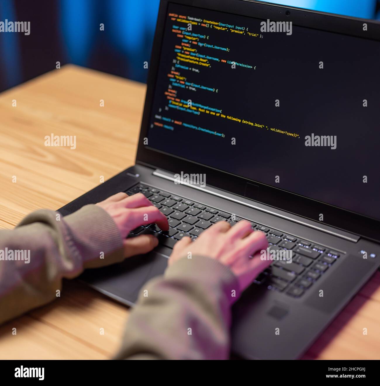 Woman coding on laptop Stock Photo - Alamy