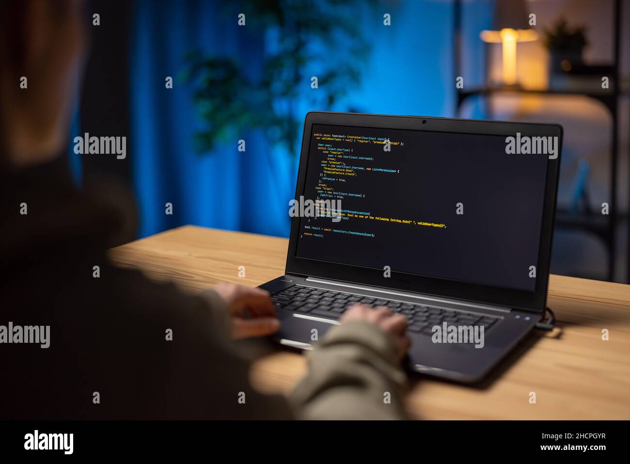 Developer working on laptop Stock Photo - Alamy