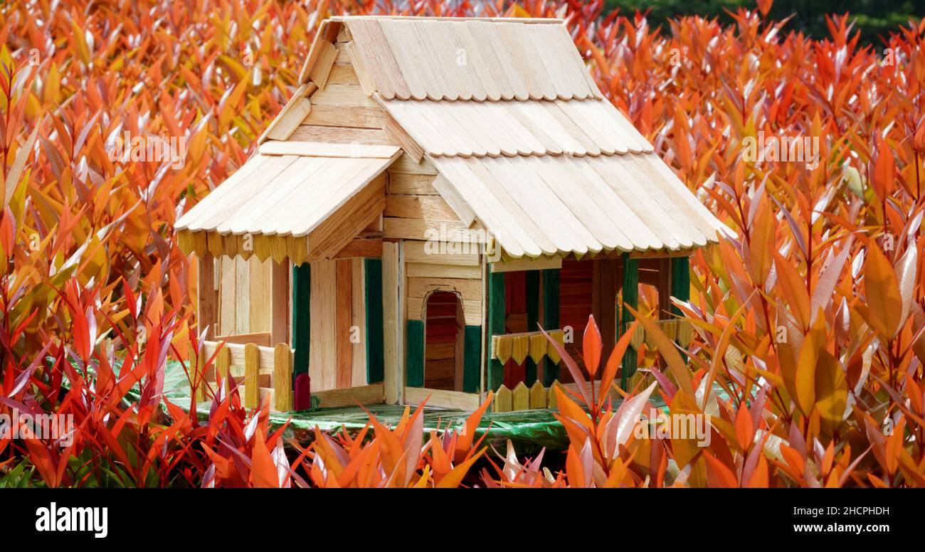A traditional house made of pieces of wood as a miniature. Betawi ...