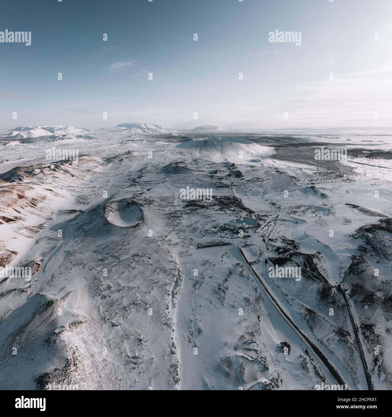 Aerial drone panorama snowy winter landscape view of huge volcano cone ...