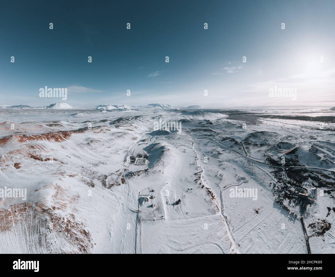 Aerial drone panorama snowy winter landscape view of huge volcano cone ...