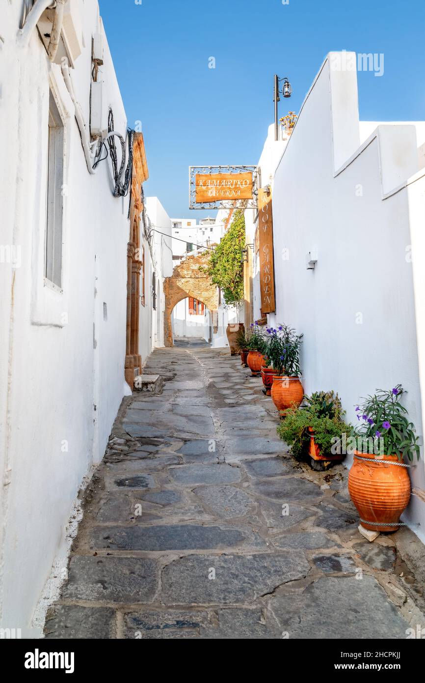 Shot through the typical Greek streets of Lindos, Greece - Rhodes Stock ...