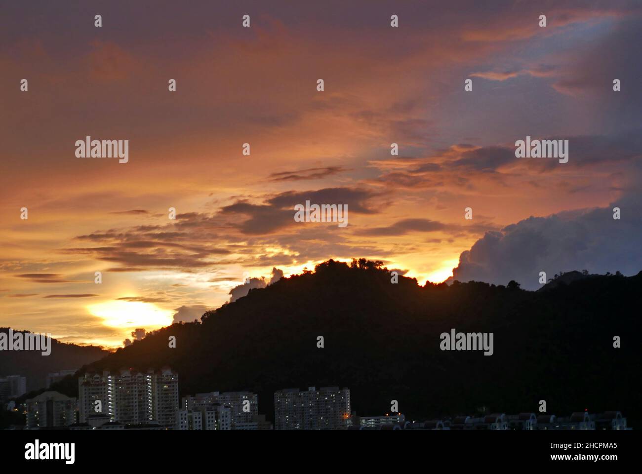 Scenic view of a vibrant sunset at western Penang hills in Malaysia ...