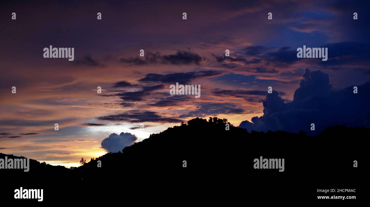 Scenic view of a vibrant sunset at western Penang hills in Malaysia ...