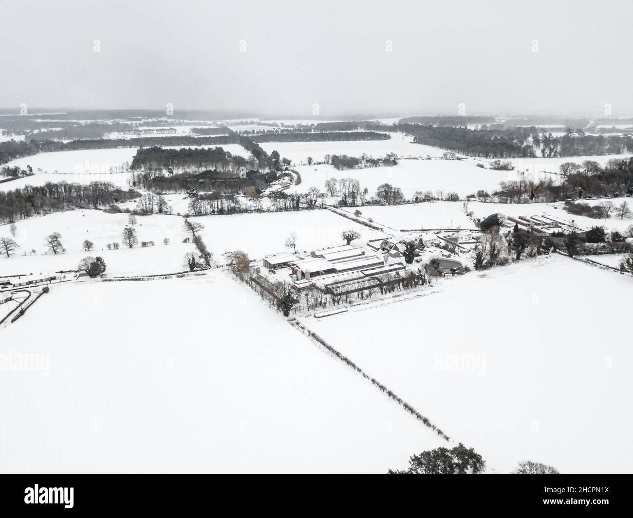 Aerial view of a small village in the British countryside during a rare ...