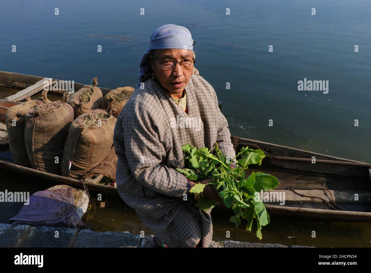 Srinagar, Jammu and Kashmir, India. 31st Dec, 2021. A woman selling ...