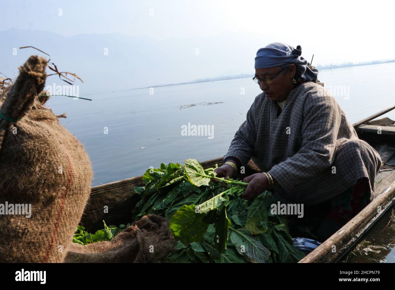 Srinagar, Jammu and Kashmir, India. 31st Dec, 2021. A woman selling ...