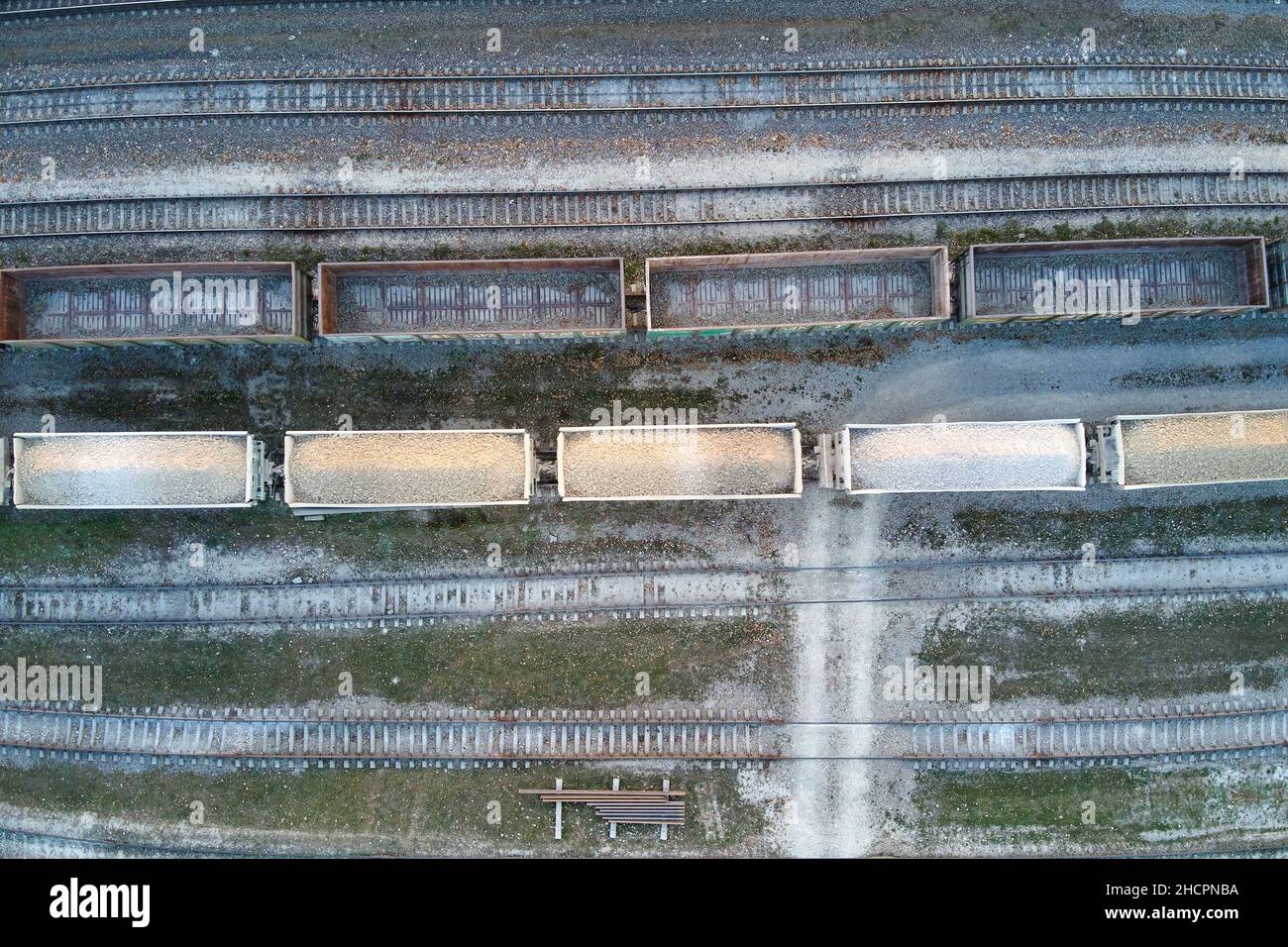 Aerial view of cargo train loaded with crushed sandstone materials at ...