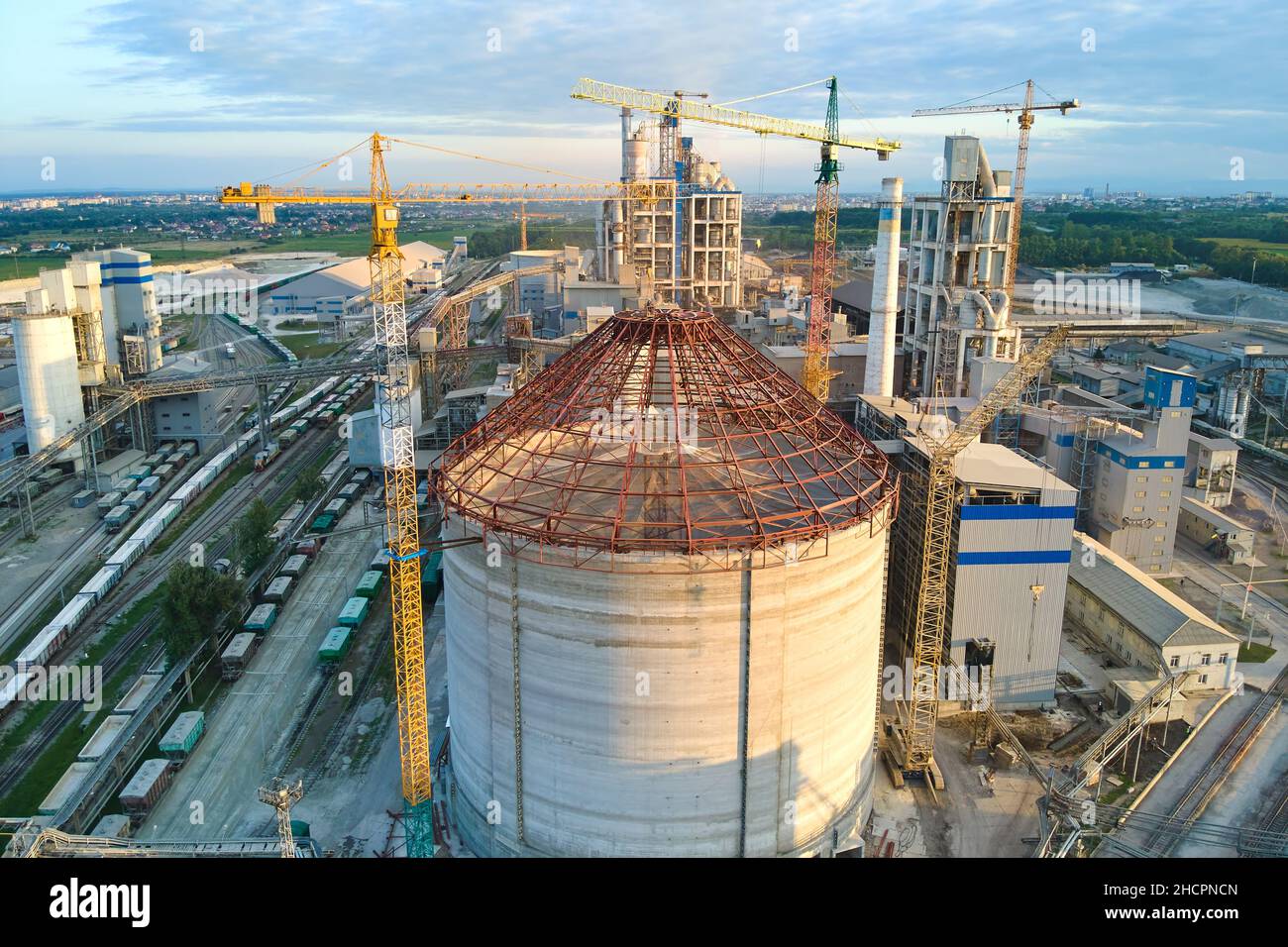 Aerial view of cement factory under construction with high concrete ...