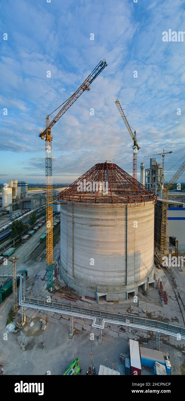 Aerial view of cement factory under construction with high concrete ...