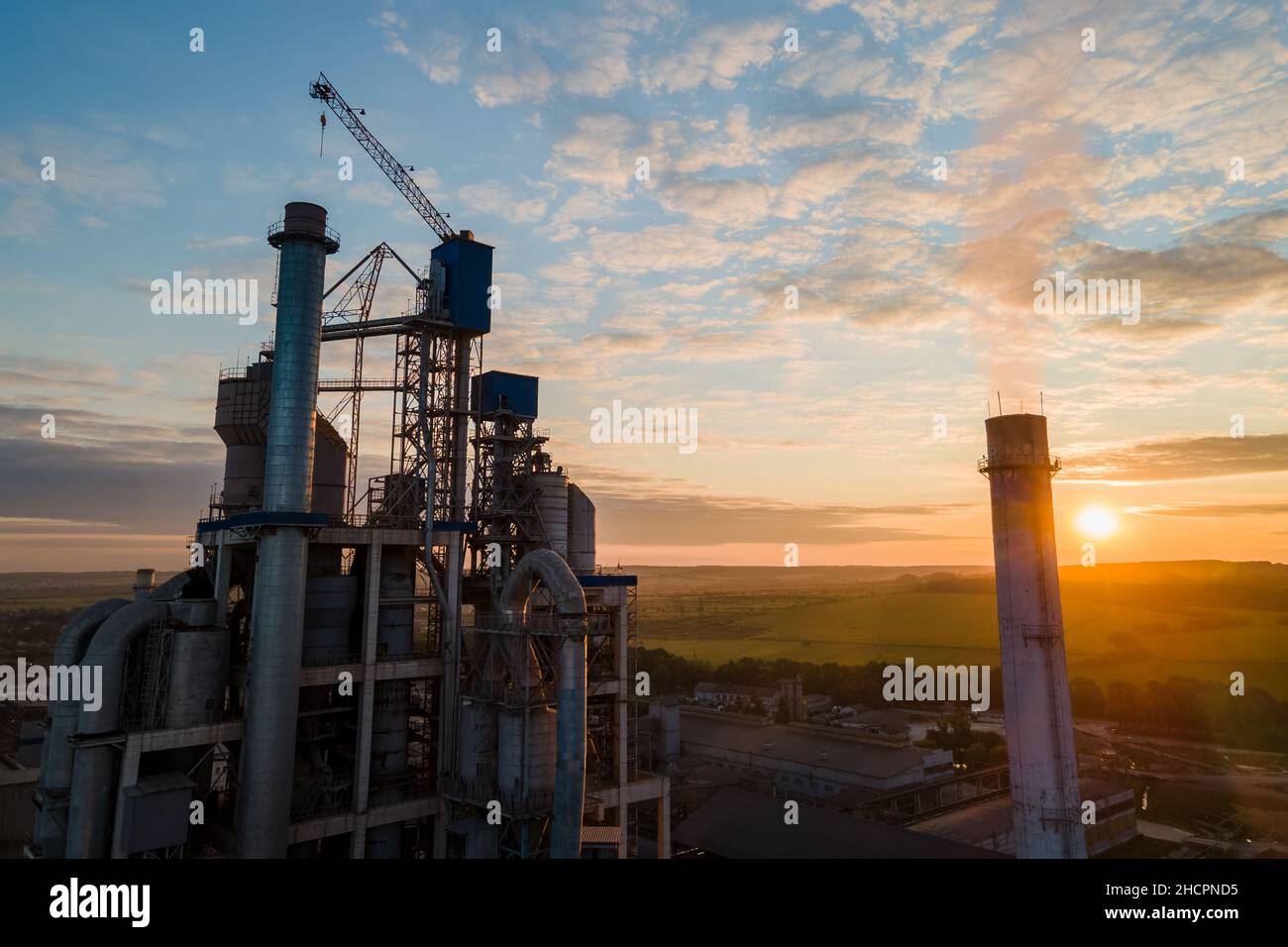 Aerial view of cement factory with high concrete plant structure and ...