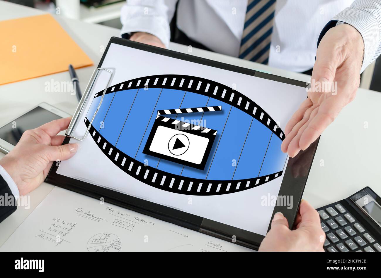 Cinema concept shown by a businessman Stock Photo - Alamy