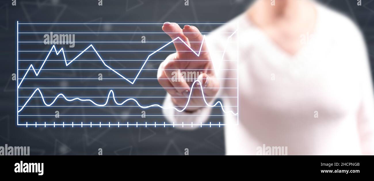 Woman touching business charts on a touch screen with her fingers Stock ...