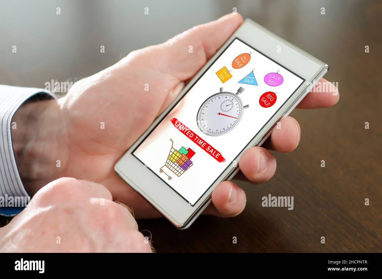 Hand holding a smartphone with limited time sale concept Stock Photo ...