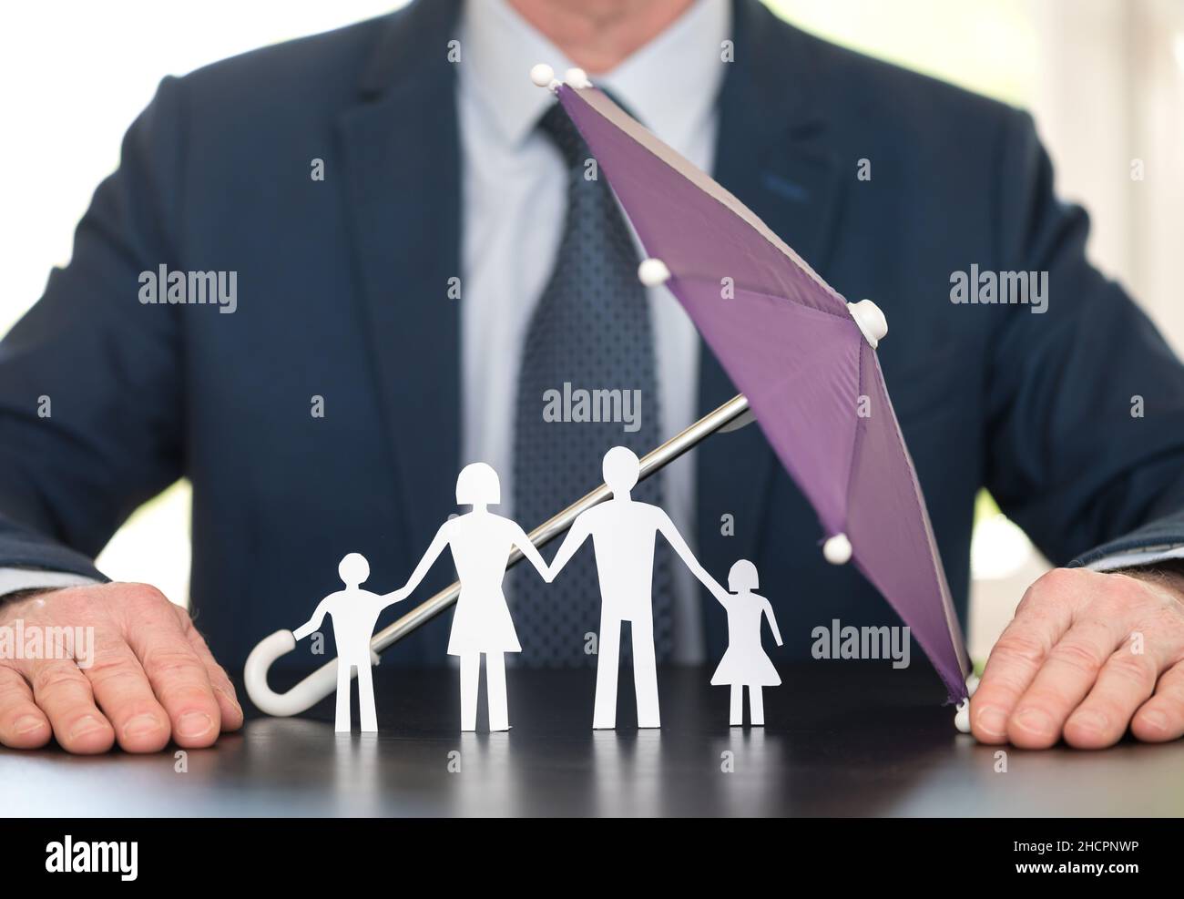 Symbol of family protection by a general agent Stock Photo - Alamy