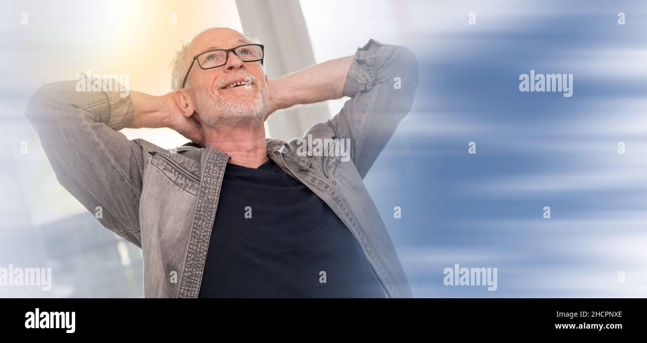 Relaxed mature man daydreaming, light effect Stock Photo - Alamy