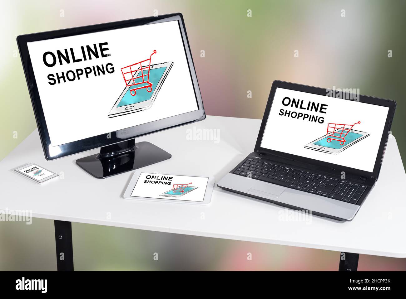 Online shopping concept shown on different information technology ...