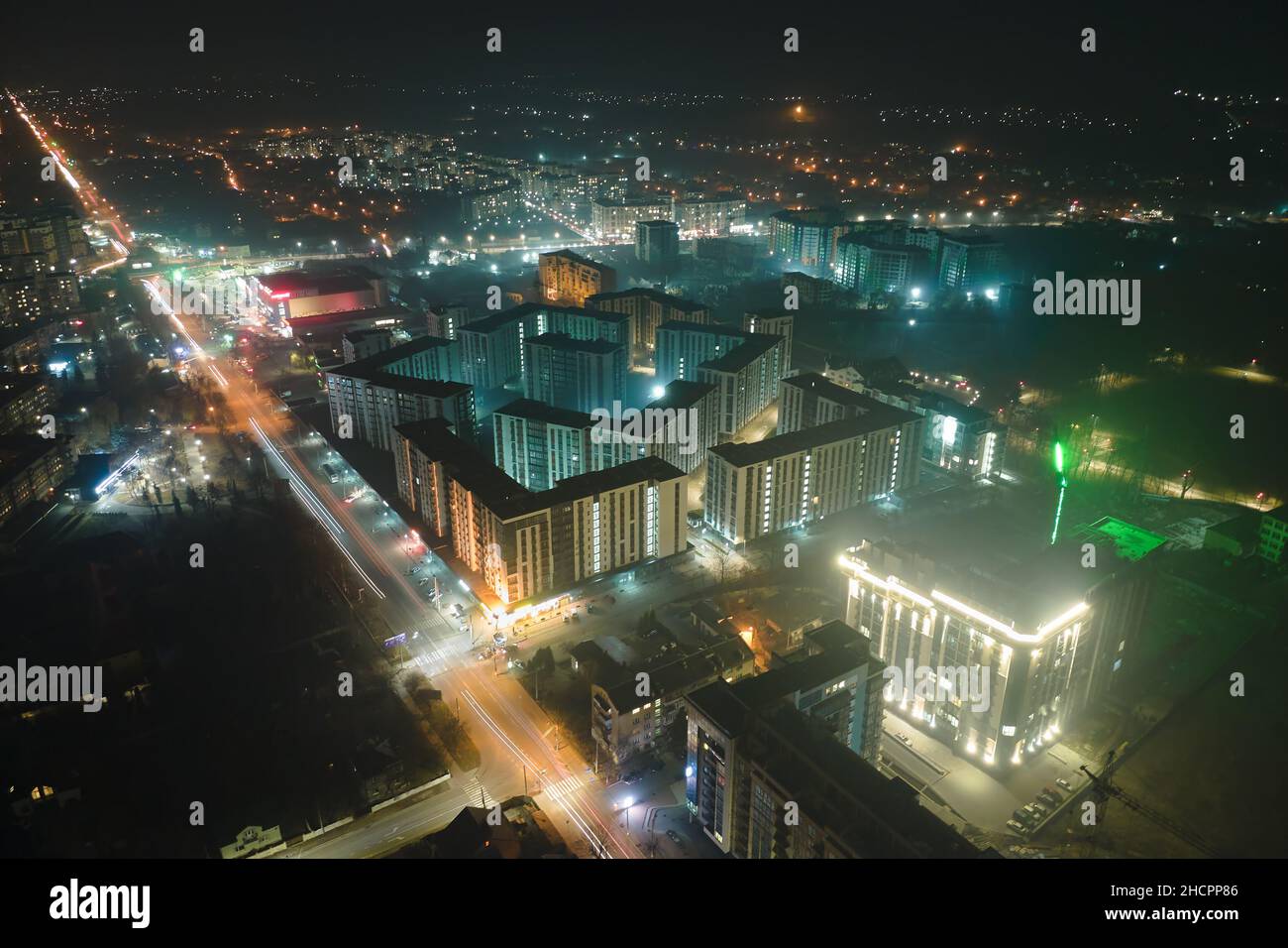 Aerial view of high rise apartment buildings and bright illuminated ...