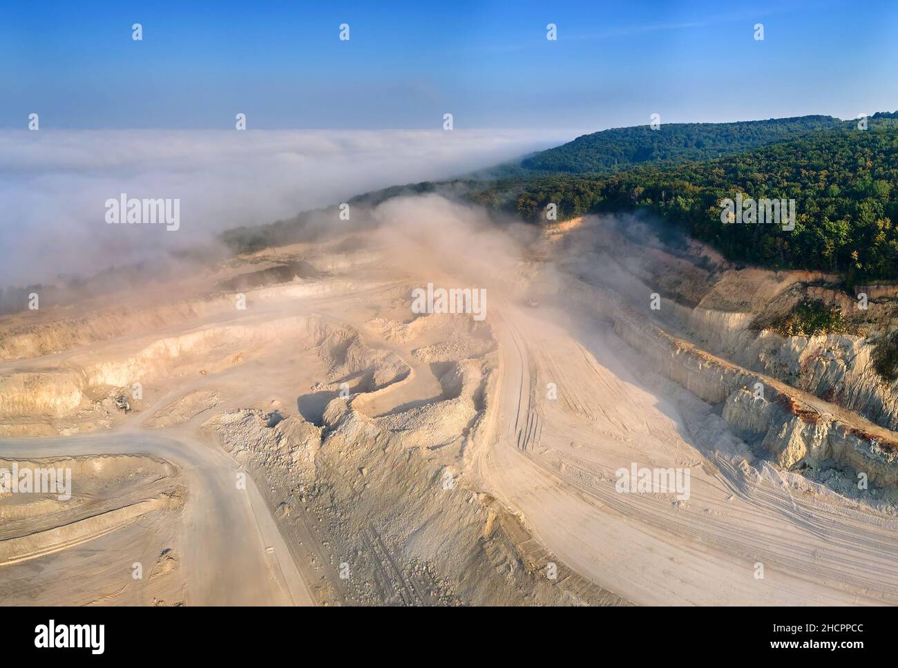 Aerial view of open pit mining of limestone materials for construction ...