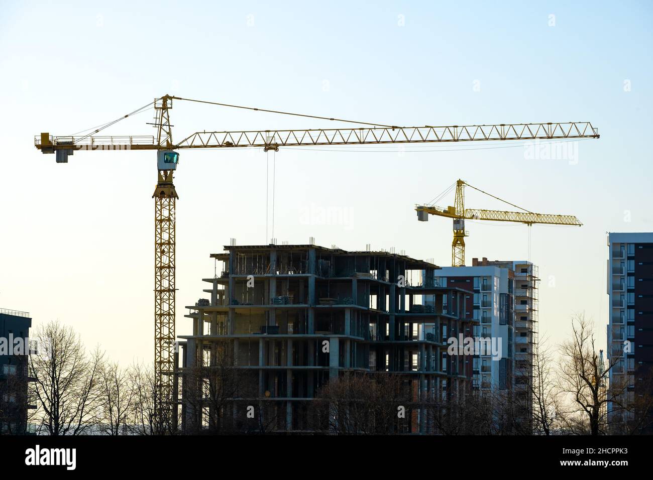 Aerial view of tower cranes and high residential apartment buildings ...
