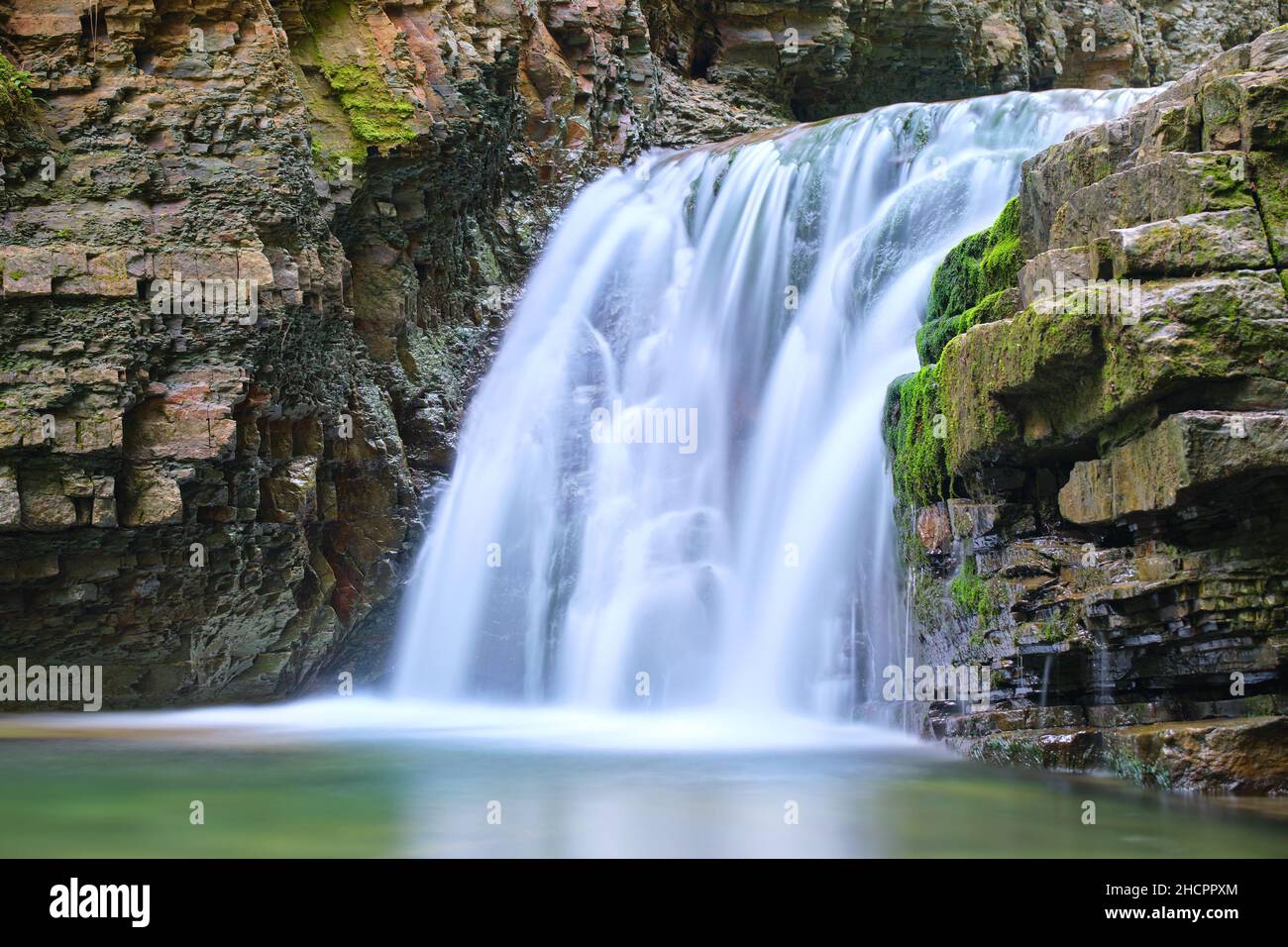Amazing landscape of beautiful waterfall on mountain river with white ...