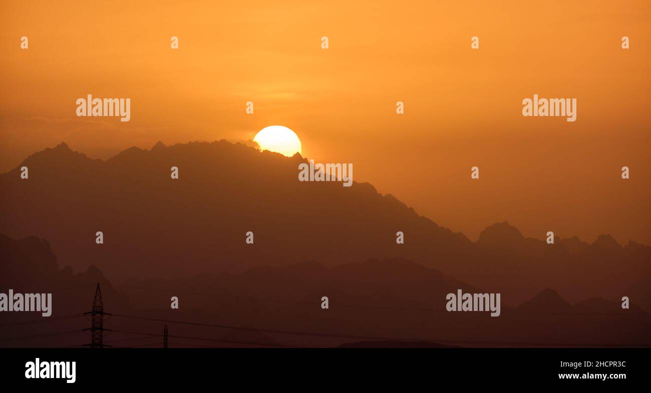 Beautiful evening panoramic landscape with bright setting sun over ...