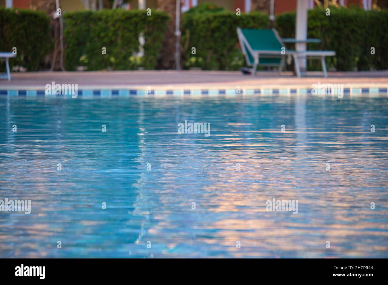 Blue clear water with small ripple waves in swimming pool at tropical ...