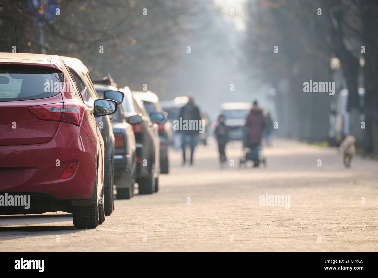 City traffic with cars parked in line on street side Stock Photo - Alamy