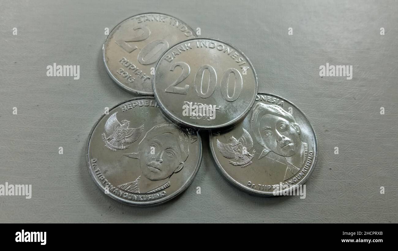 Some currency in the form of coins with a nominal value of 200 rupiah ...