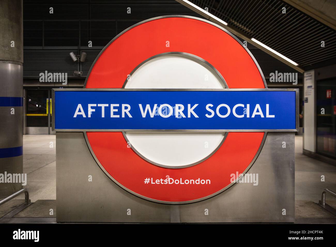 'After Work Social' signage, a tube underground sign at Canary Wharf ...