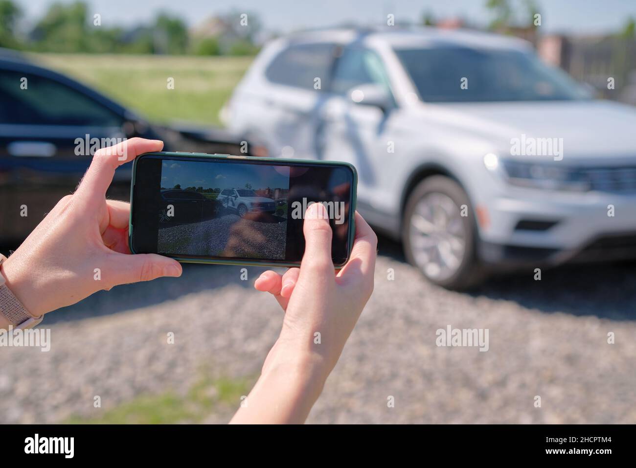 Driver hands taking photo on mobile phone camera after vehicle ...