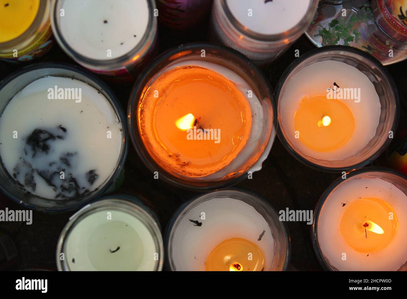 Many jars of lit candles as wishfully thinking for hopes and dreams to ...